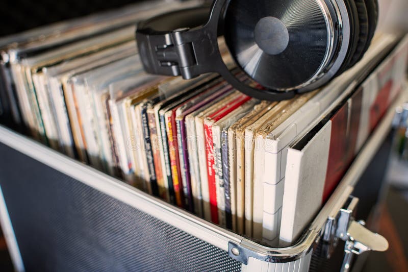 Headphones and Records Collection in a DJ Case. Close-up Editorial ...