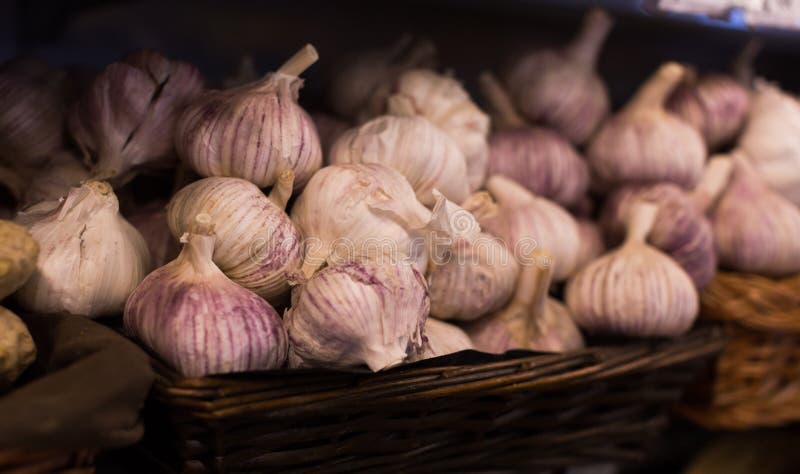 Heads of Fragrant Garlic in Baskets on Market Counter Stock Photo ...