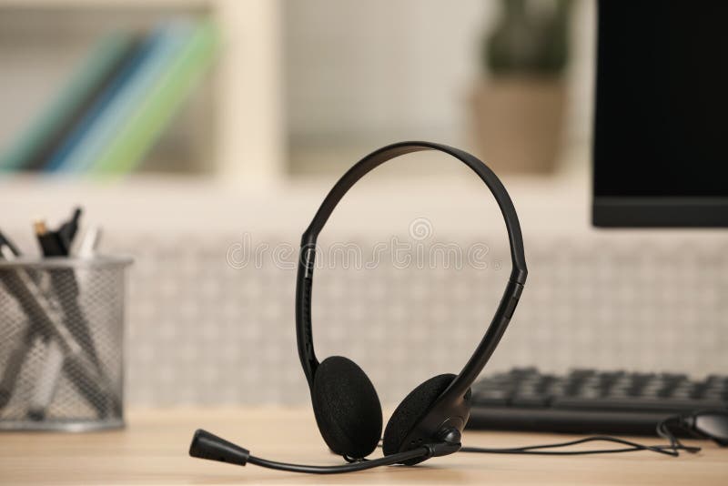 Headset and Computer on Table Indoors. Hotline Concept Stock Photo ...