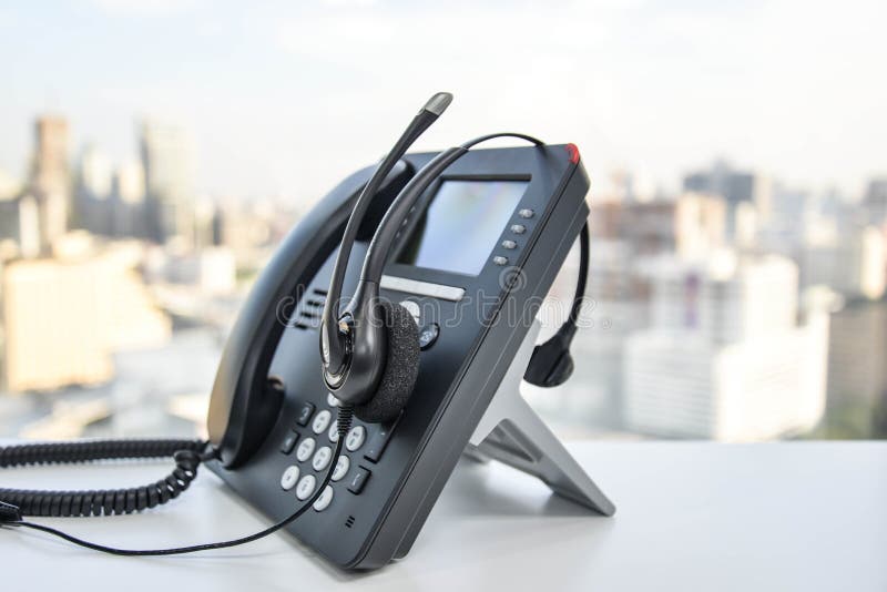Headset and the IP Phone stock image. Image of number - 62640875
