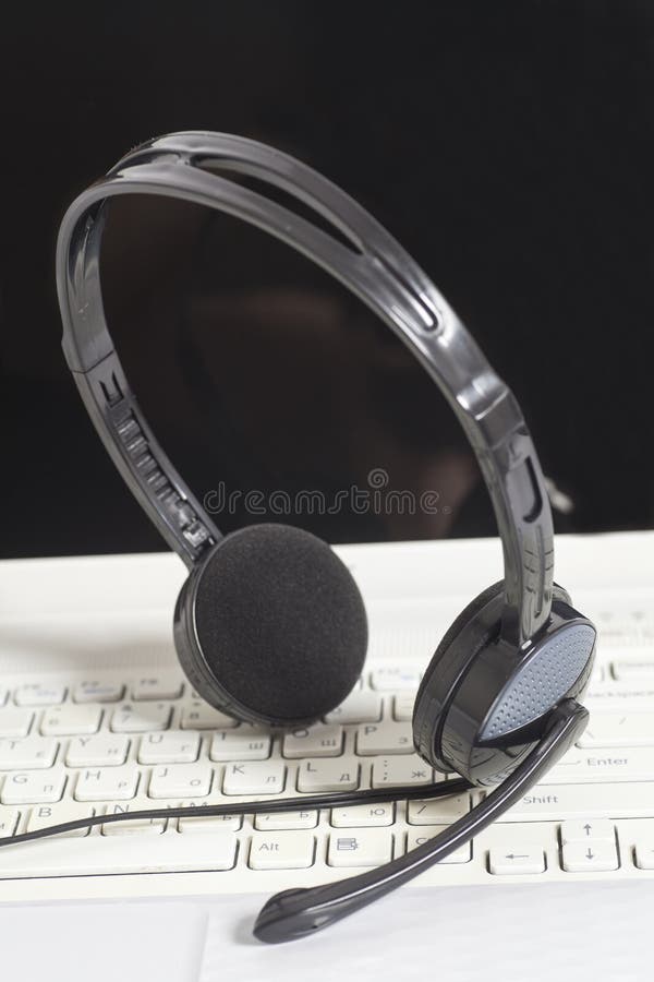 Headset on Laptop Computer Keyboard Stock Photo - Image of customer ...