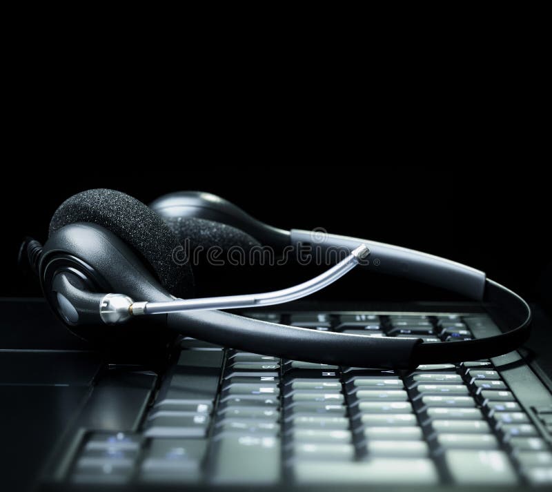Headset on a Laptop Computer Keyboard Stock Photo - Image of desk ...