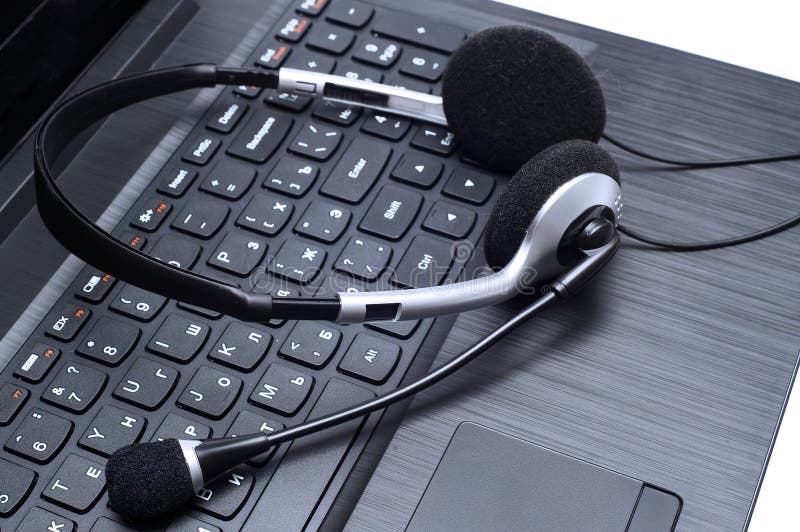Headset Lying on a Laptop Computer Keyboard Stock Image - Image of call ...