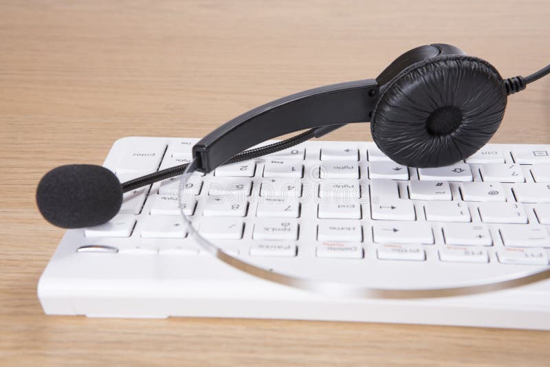 Headset and Mike Lying on a Computer Keyboard Stock Image - Image of ...