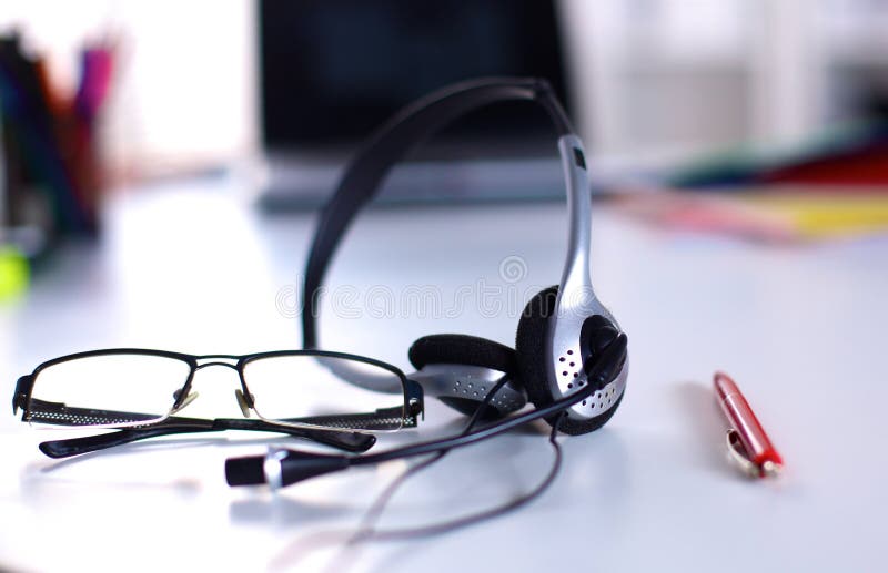 Headset on the Table with Notebook and Pen Stock Image - Image of ...