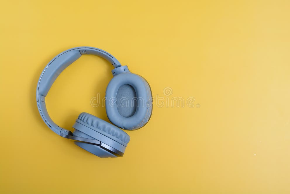 Earphones on Yellow Background. Stock Image - Image of object ...