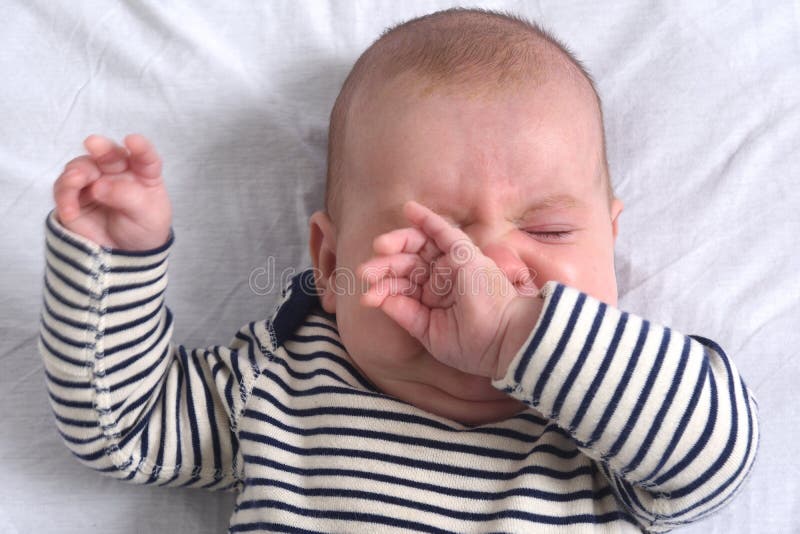 Portrait of a Baby Lying on the Bed Stock Photo - Image of innocent ...