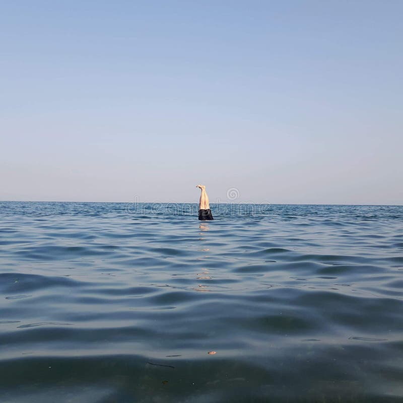 Headstand in the sea stock photo. Image of water, headstand - 156086760