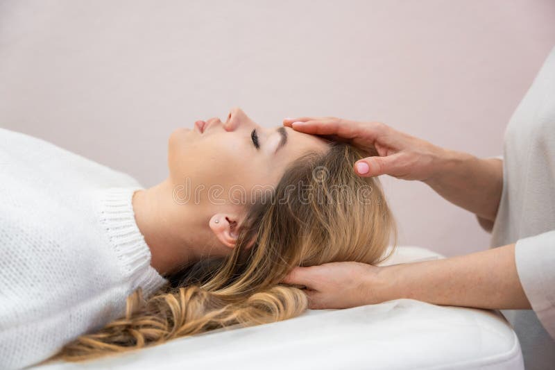 Healer Performing Set of 32 Points of Access Bars on Young Woman Head ...