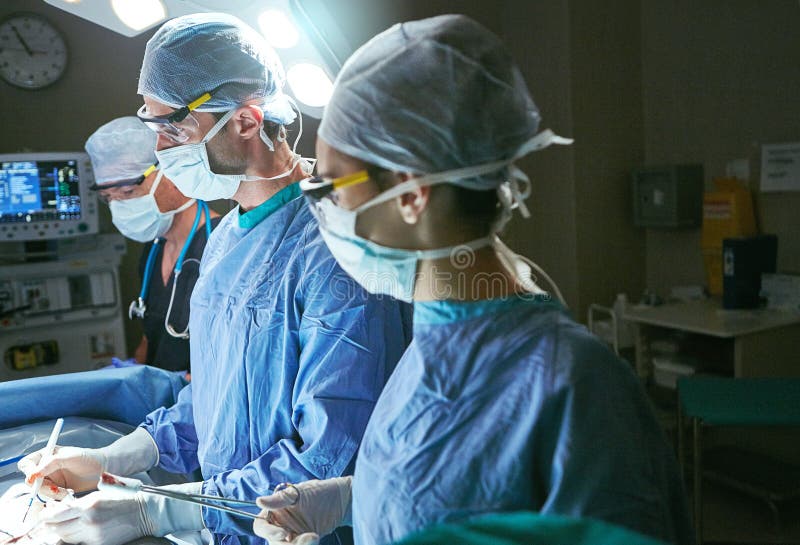 Surgery in Progress. Surgeons in an Operating Room. Stock Image - Image ...