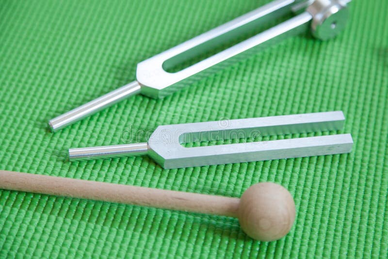 Tuning Fork and Crystal Stone on Table . Stock Image - Image of female ...