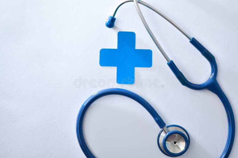 Health Background with Stethoscope Blue Cross on White Table Stock ...