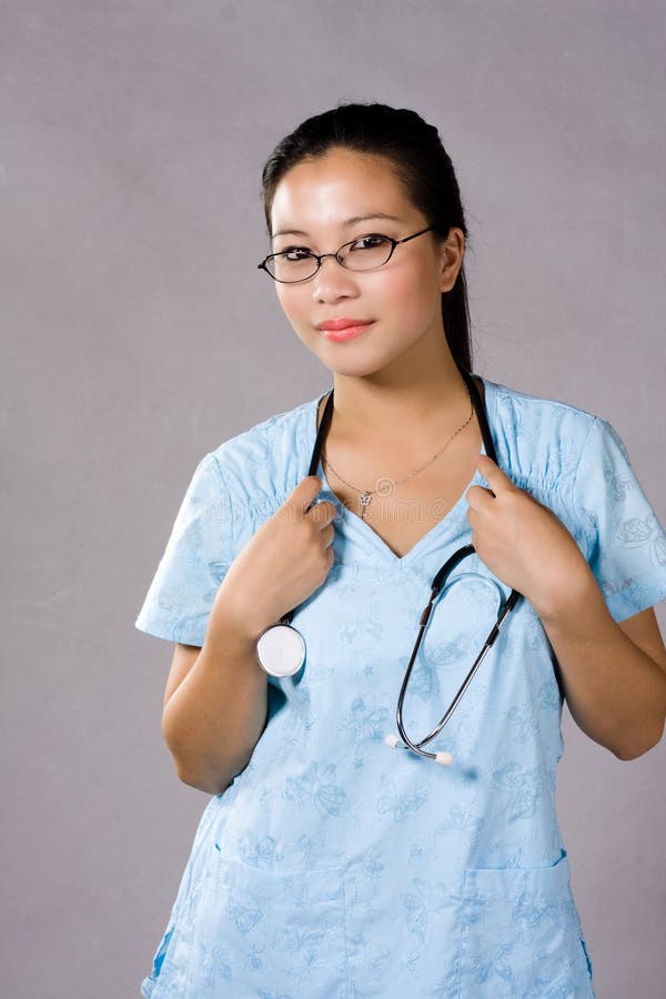 Medical Professionals: Woman Nurse Smiling while Working at Hospital ...