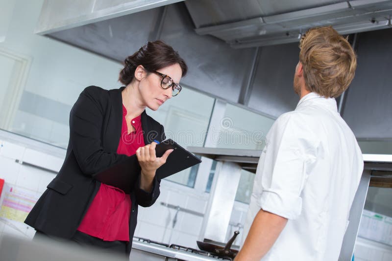 Health Inspector Inspecting Kitchen Stock Photo - Image of cook ...