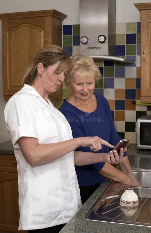 Health Visitor on a Home Visit with Elderly Lady Stock Photo - Image of ...