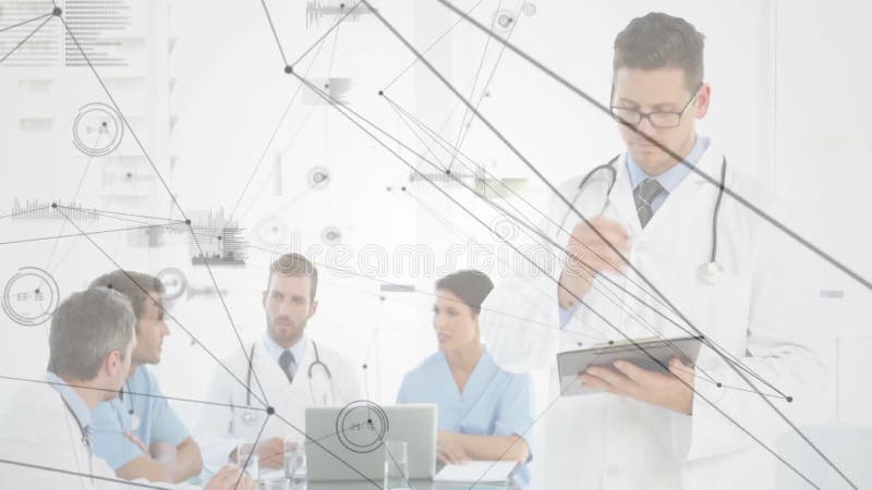 Healthcare Team Collaborating Around Table Analyzing Data on Laptop and ...