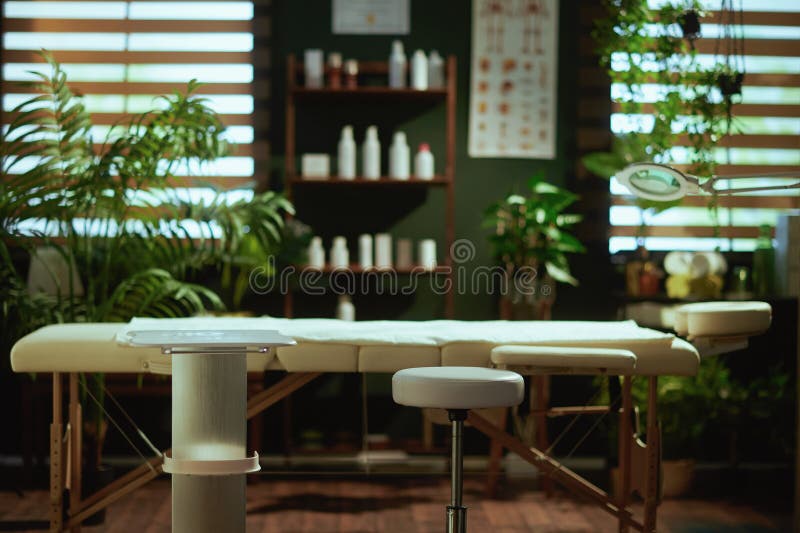 Massage Table and Table on Wheels in Modern Massage Cabinet Stock Photo ...