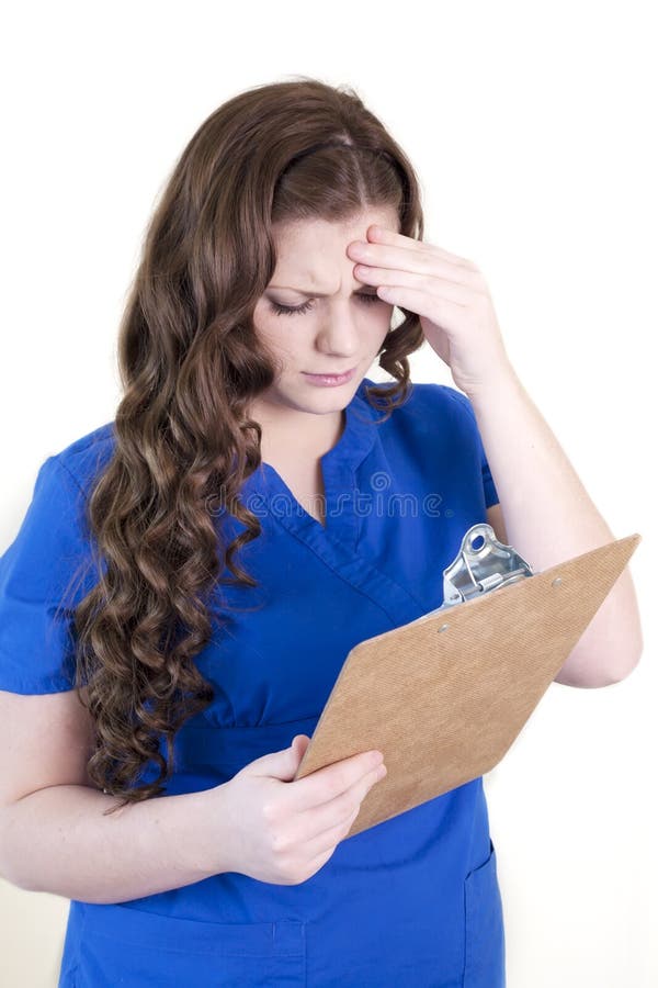 Healthcare Worker with Clipboard with Headache or Confusion Stock Image ...