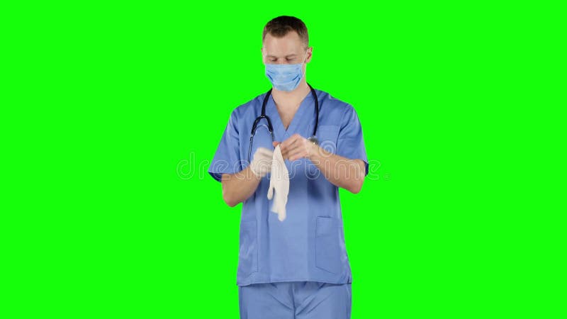 Healthcare Worker Putting On Medical Gloves Green Screen Stock Footage
