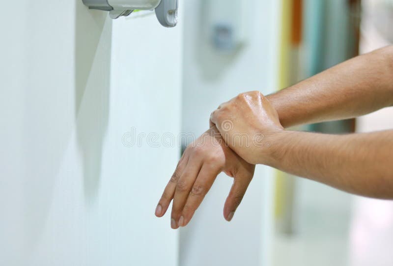 A Doctor Rubbing the Wrist with Alcohol-based Hand Rub. Stock Image ...