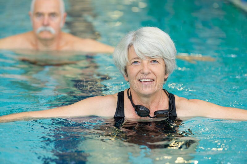 Healthy Active Senior Woman Swimming in Pool Stock Photo - Image of ...