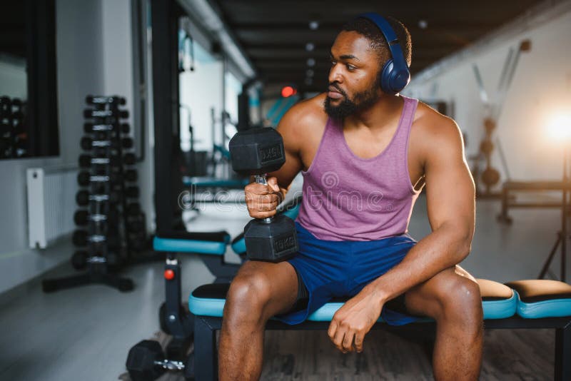 Healthy African Man Working Out with Dumbbells in Gym. Stock Image ...