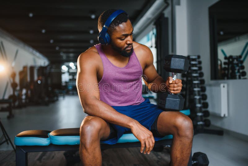 Healthy African Man Working Out with Dumbbells in Gym. Stock Image ...