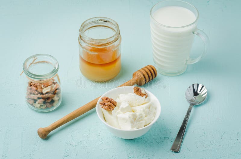Healthy Breakfast Background. Honey, Milk, Cottage Cheese and Walnut on ...