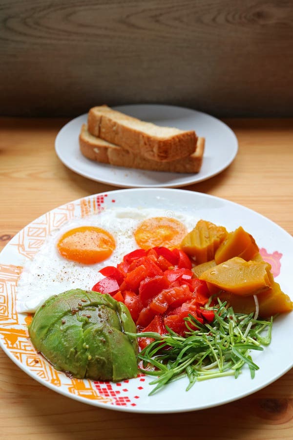 Healthy Breakfast Dish of Sunny-side Up Eggs with Microgreen and ...