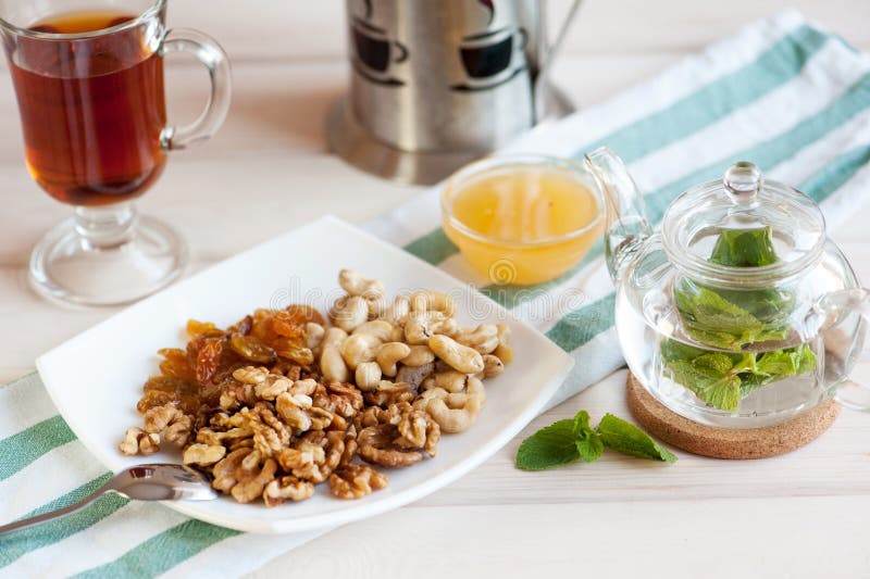 Healthy Breakfast: Nuts Mix and Mint Tea Stock Photo - Image of mint ...