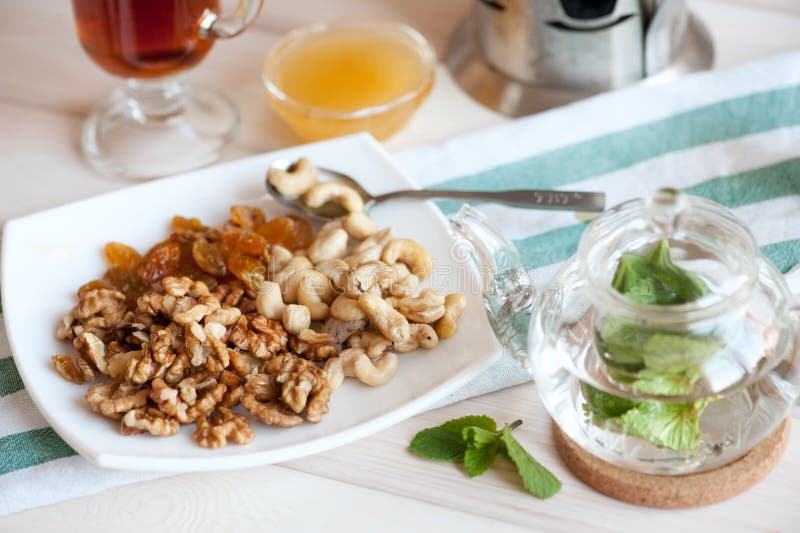 Healthy Breakfast: Nuts Mix and Mint Tea Stock Photo - Image of edible ...