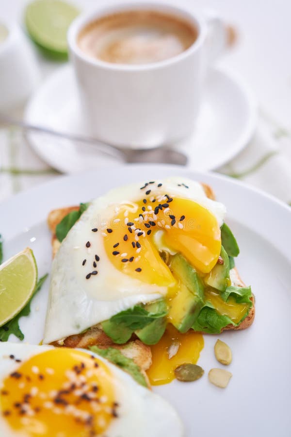 Healthy Breakfast Or Snack Sliced Avocado And Fried Egg On Toasted