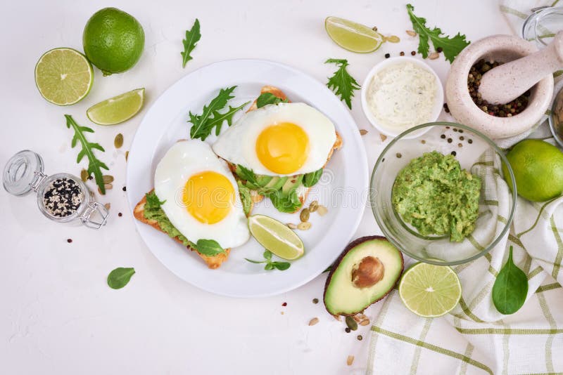 Healthy Breakfast Or Snack Sliced Avocado And Fried Egg On Toasted