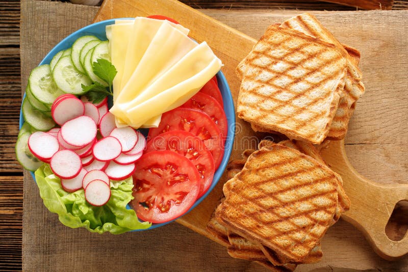 Healthy Breakfast of Toast with Yellow Cheese and Vegetables Stock ...