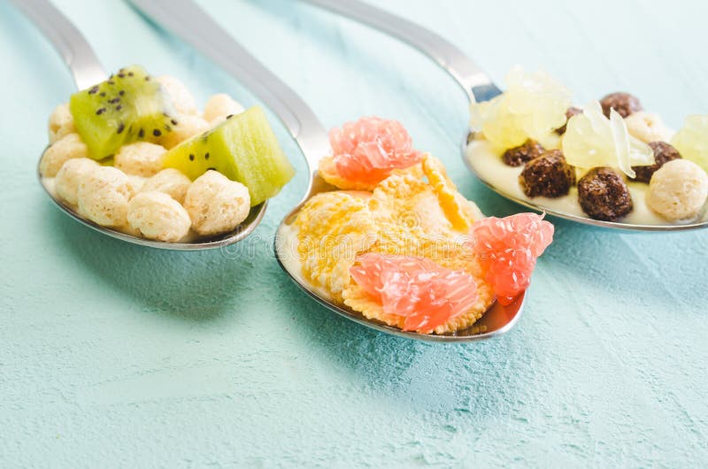 Healthy Breakfast. Yogurt, Flakes and Fruit in Spoons on a Blue ...