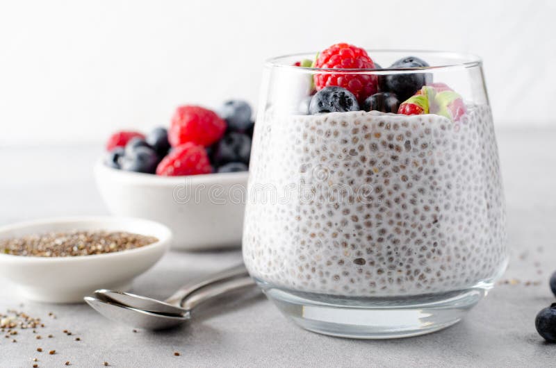 Healthy Chia Pudding in a Glass with Raspberry Jam and Fresh Berries ...