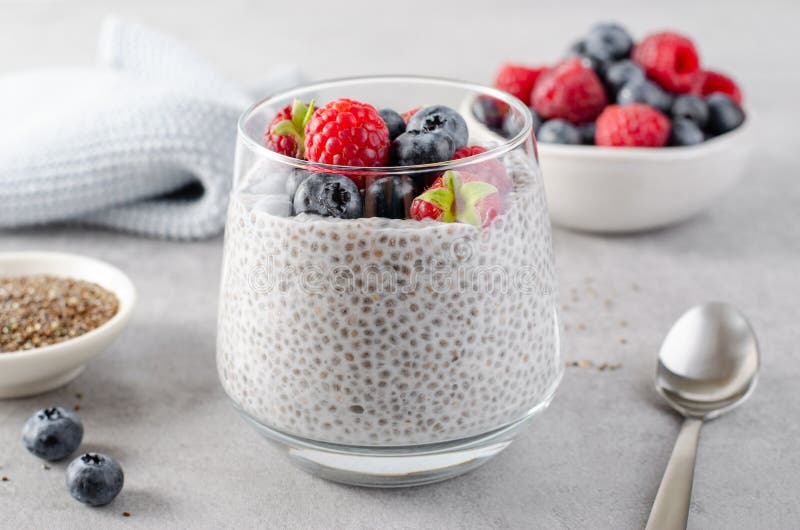 Healthy Chia Pudding in a Glass with Raspberry Jam and Fresh Berries ...