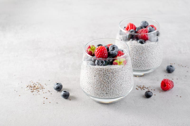 Healthy Chia Pudding in a Glass with Raspberry Jam and Fresh Berries ...