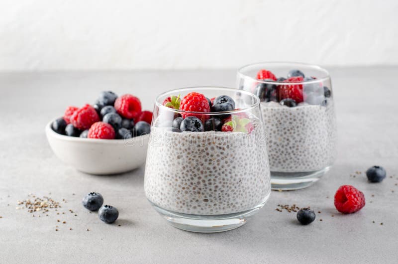 Healthy Chia Pudding in a Glass with Raspberry Jam and Fresh Berries ...