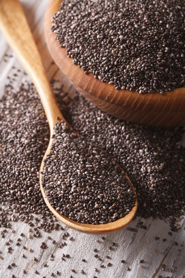 Healthy Chia Seeds in a Wooden Spoon Macro. Vertical Stock Image ...
