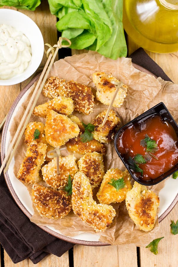 Healthy Chicken Nuggets with Sesame Seeds Stock Photo - Image of sauce ...