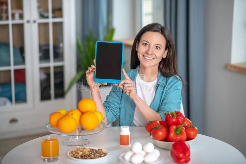 Woman Using a Table while Having a Meal Stock Image - Image of female ...
