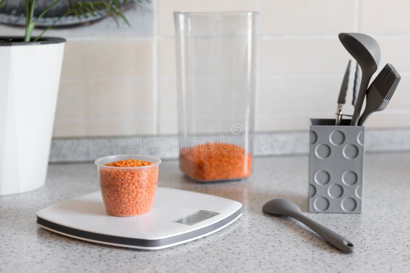 Healthy Food or Diet Concept. Kitchen Scale with Measuring Cup with ...