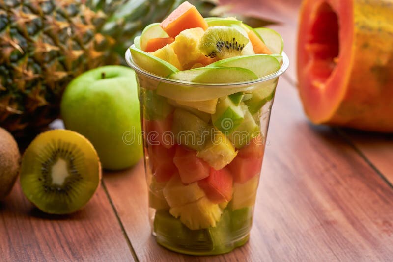 Healthy Fruit Salad with Kiwi, Apple, Pineapple, and Melon in a Plastic ...