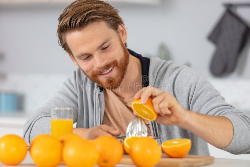 Healthy Handsome Man Making Organic Orange Fruit Juice Stock Image ...