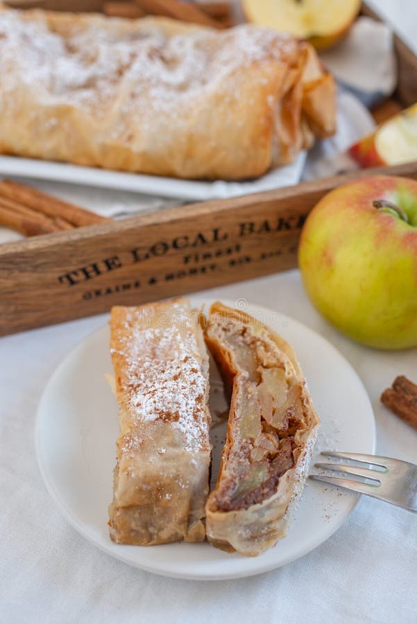 Healthy Home Made Sweet Apple Strudel with Apples, Cinnamon on a Table ...