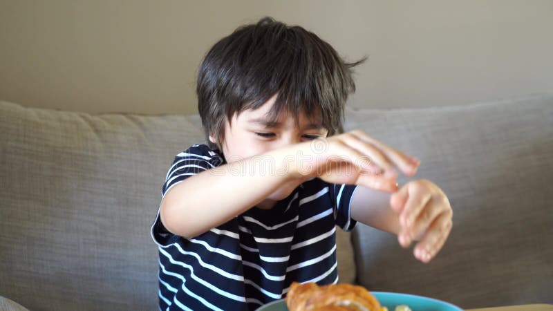 Healthy Kid Boy Tasting Sliced Lime or Lemon with Funny Face while ...