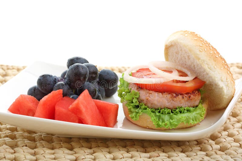 Healthy Low Fat Chicken Burger with Fruit Isolated Stock Image - Image ...