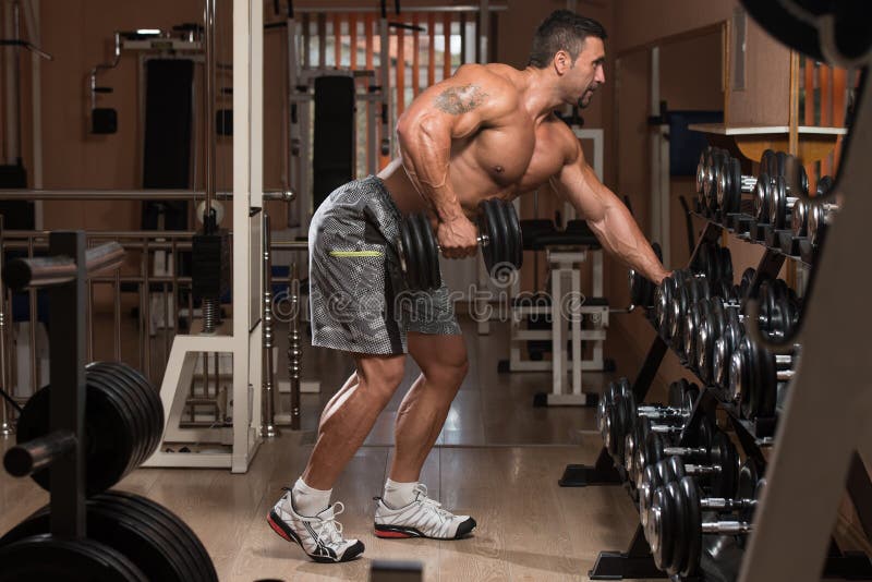 Healthy Man Doing Exercise for Back with Dumbbells Stock Image - Image ...
