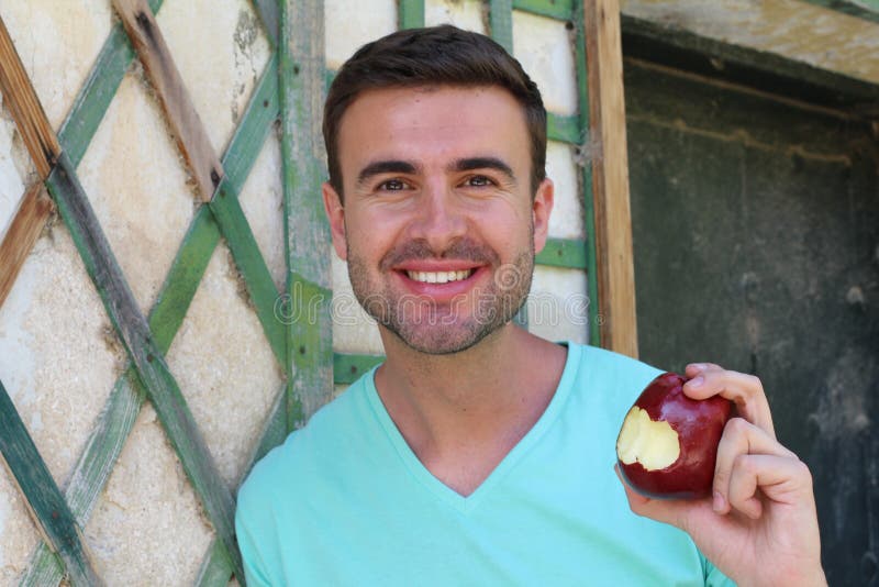 Healthy Man Eating an Apple Joyfully Stock Image - Image of apple ...
